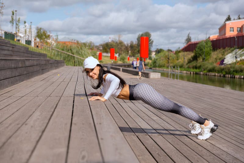 Young Woman Working Out Push-ups in the Street Stock Photo - Image of ...