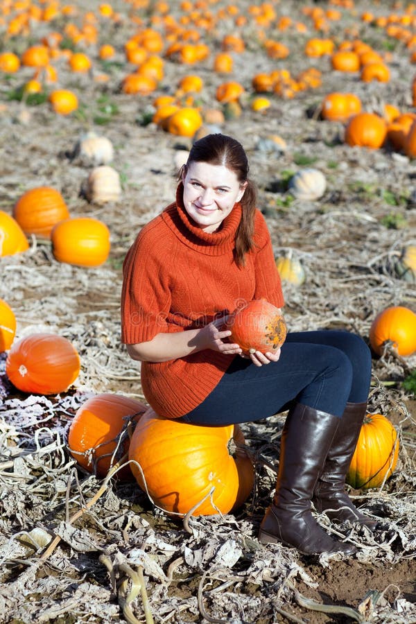 Young Woman Working on Pumpkin Field Stock Photo - Image of autumn ...