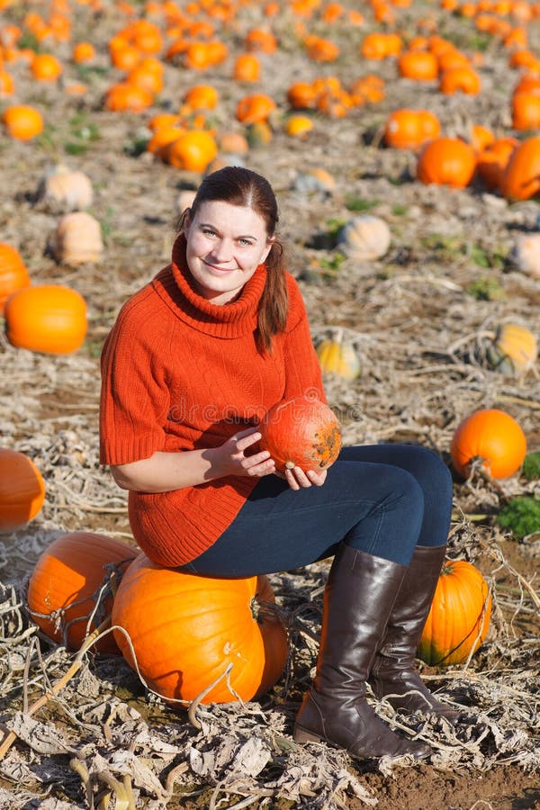 Young Woman Working on Pumpkin Field Stock Photo - Image of pumpkin ...