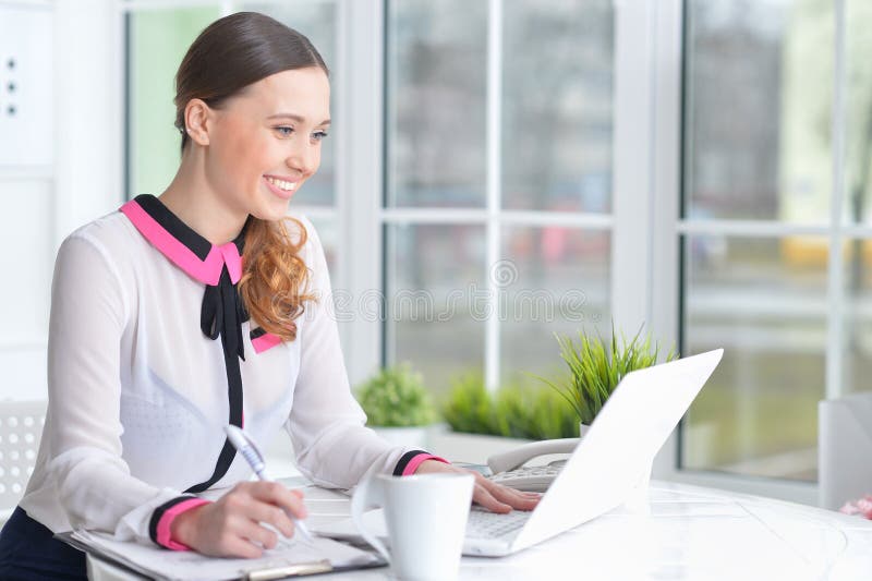 Young Woman Working at Table with Laptop at Home Stock Photo - Image of ...