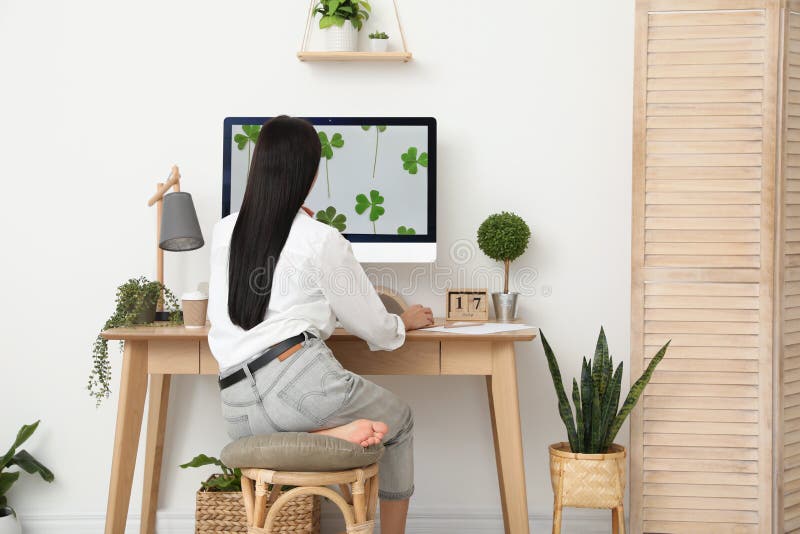 Young Woman Working at Table in Light Room, Back View. Home Office ...