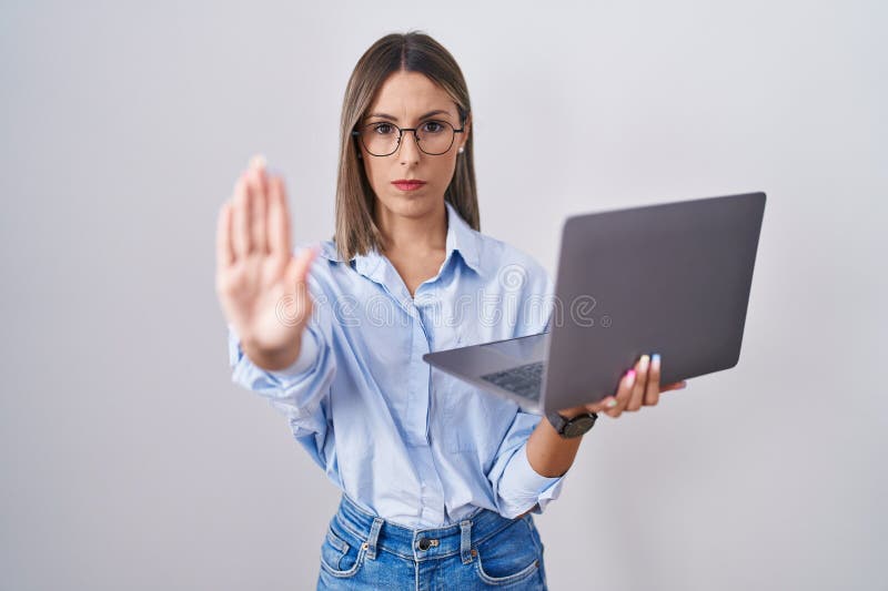 Young Woman Working Using Computer Laptop Doing Stop Sing with Palm of ...