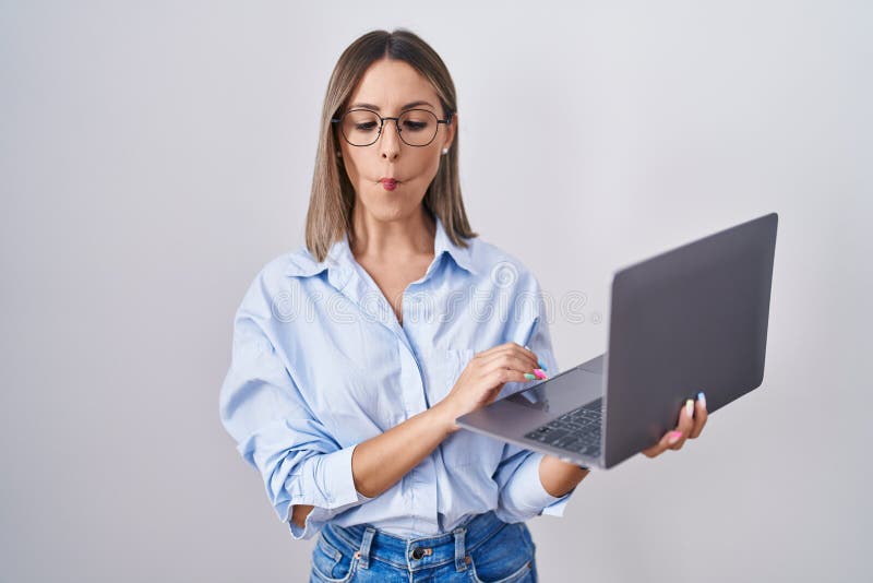 Young Woman Working Using Computer Laptop Making Fish Face with Lips ...