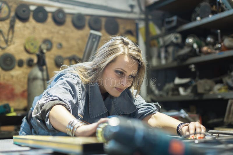 Young Woman Working in a Workshop Stock Image - Image of adult, person ...