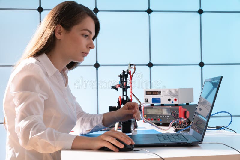 A Young Woman Writes an Algorithm for the Robot Arm. Science Research ...