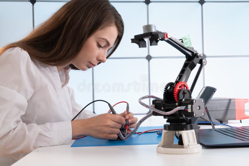 A Young Woman Writes an Algorithm for the Robot Arm. Science Research ...