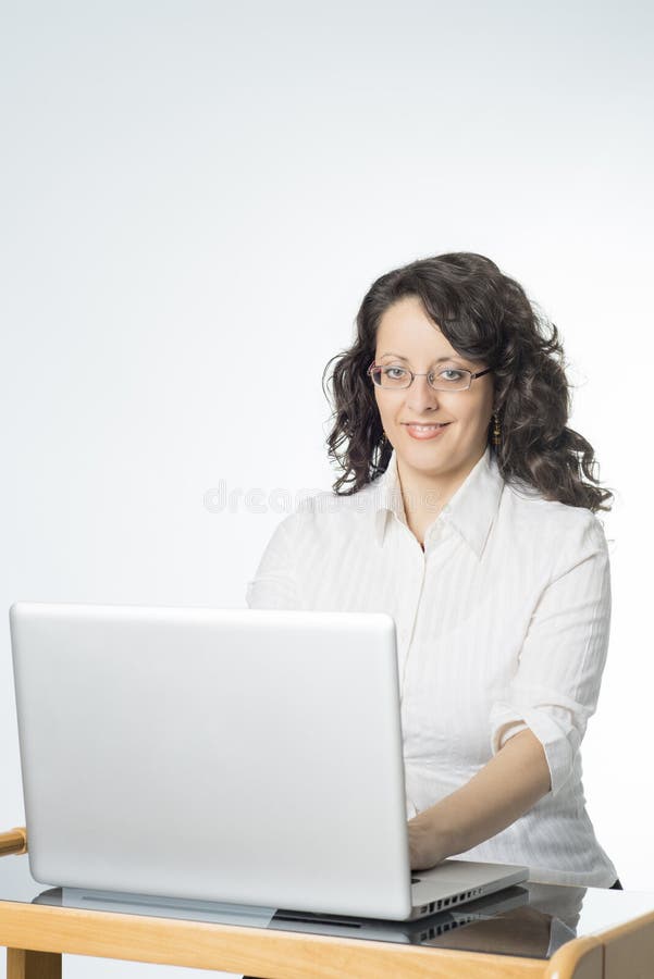 Young Woman Writing in a Laptop Stock Photo - Image of smiling, brown ...