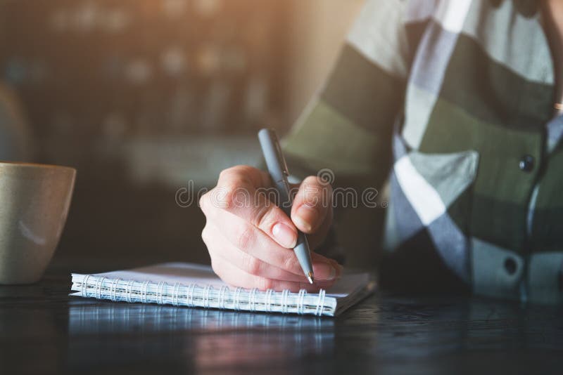 Young Woman Writing Notes on Notebook with Pen Stock Image - Image of ...