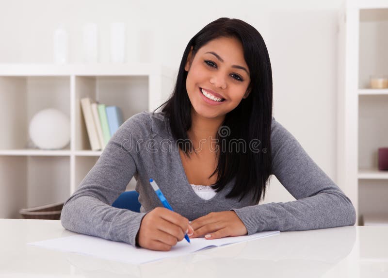 Young Woman Writing on Paper Stock Photo - Image of hispanic ...