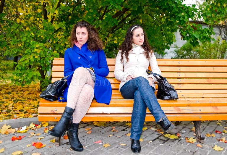 Young women on the bench stock image. Image of attractive - 11338367