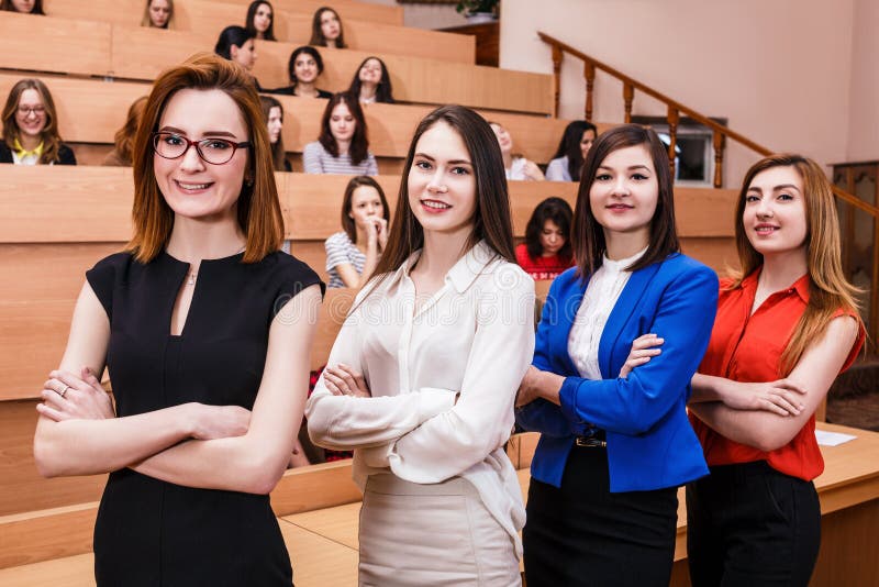 Young Women in Classroom with Students Stock Image - Image of people ...