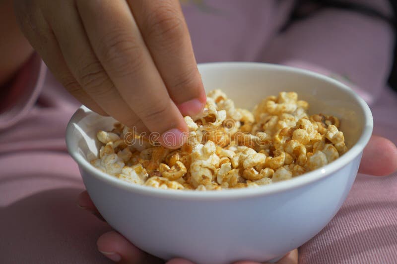 Young Women Eating Popcorn Sitting on Sofa at Home Stock Photo - Image ...