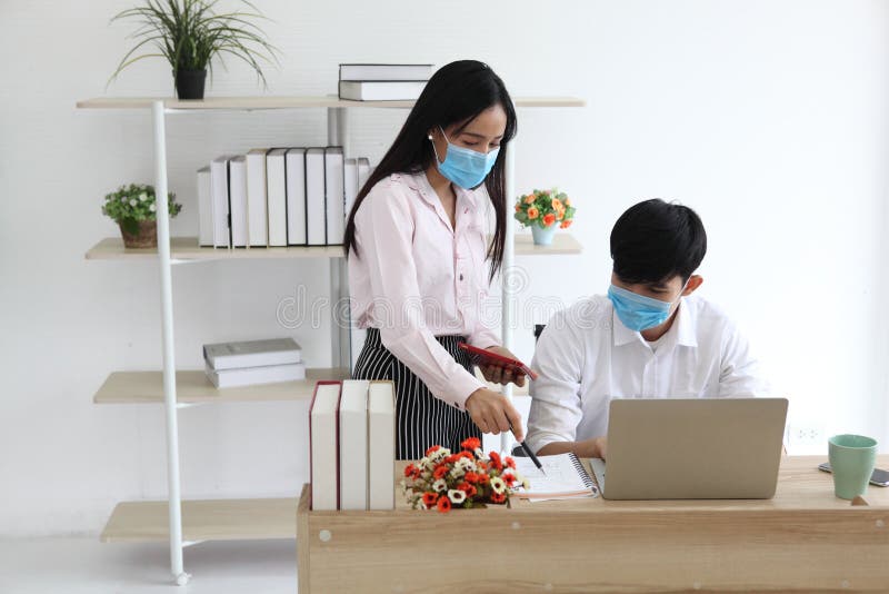 Young Man with Face Mask Back at Work in Office after Lock Down Stock ...
