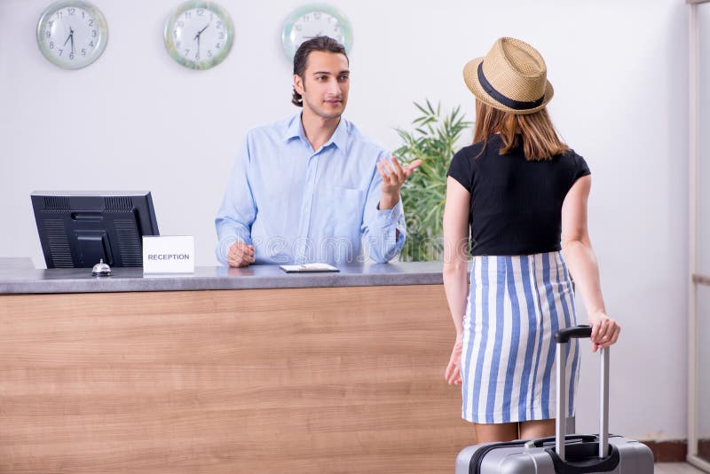 Young Woman at Hotel Reception Stock Photo - Image of lounge, hostel ...