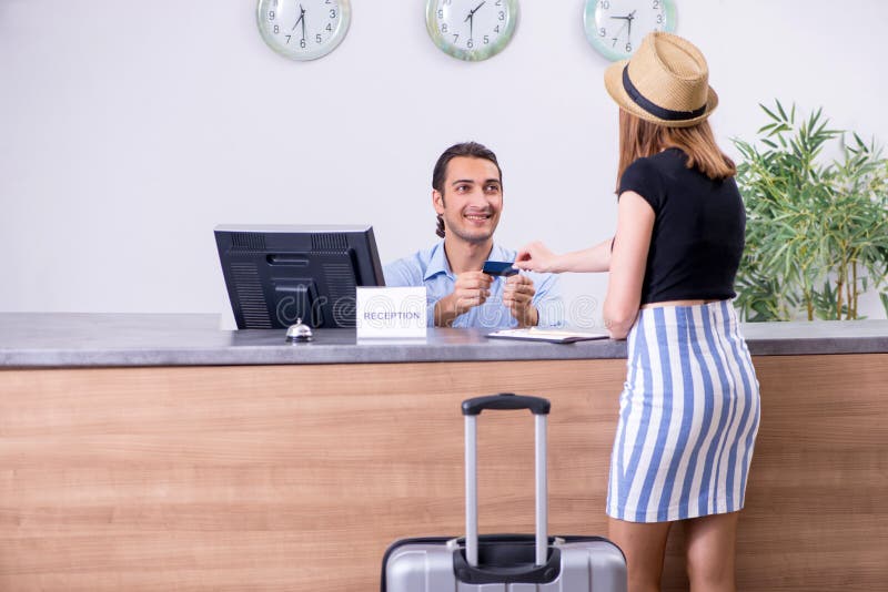 Young Woman at Hotel Reception Stock Image - Image of counter ...