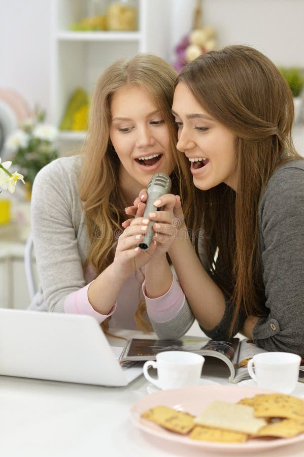Young Women with Microphones Stock Image - Image of friends, device ...