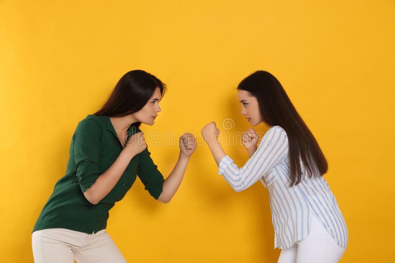 Young Women Ready To Fight on Orange Background Stock Photo - Image of ...