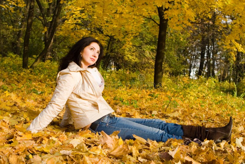 Young Women Rest on the Autumn Leaf Stock Photo - Image of lifestyles ...