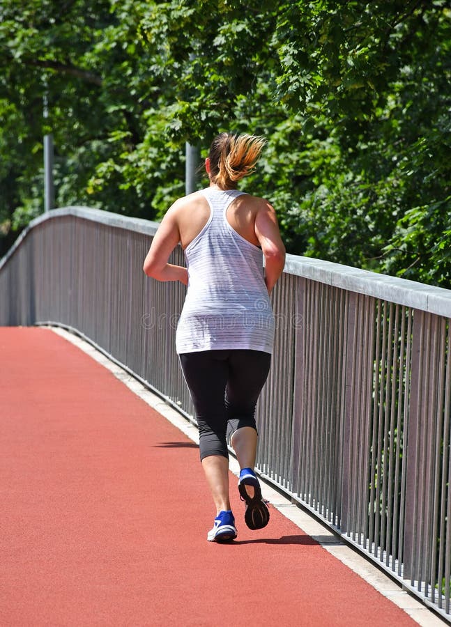 Young Women is Running on the Running Track Stock Photo - Image of ...