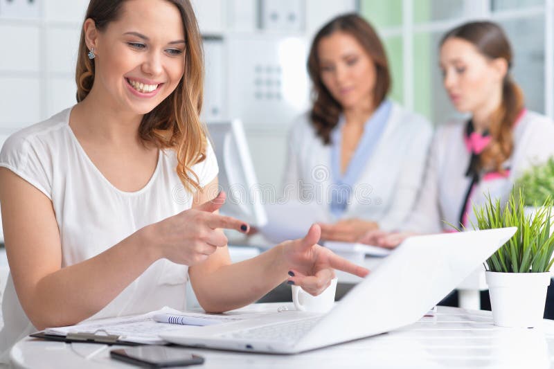 Young Women Sit at the Table and Work in a Modern Office Stock Image ...