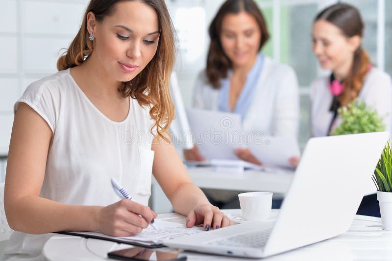 Young Women Sit at the Table and Work in a Modern Office Stock Image ...