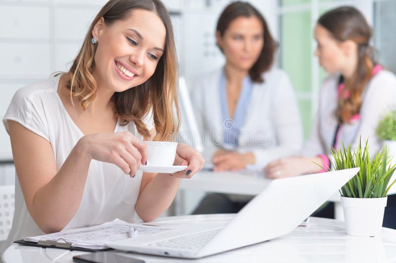 Young Women Sit at the Table and Work in a Modern Office Stock Photo ...
