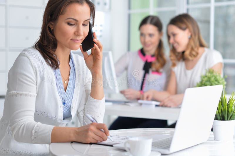 Young Women Sit at the Table and Work in a Modern Office Stock Image ...