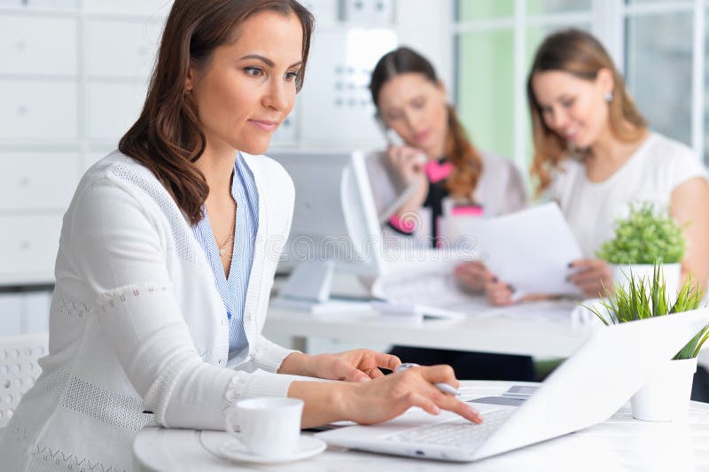 Young Women Sit at the Table and Work in a Modern Office Stock Image ...