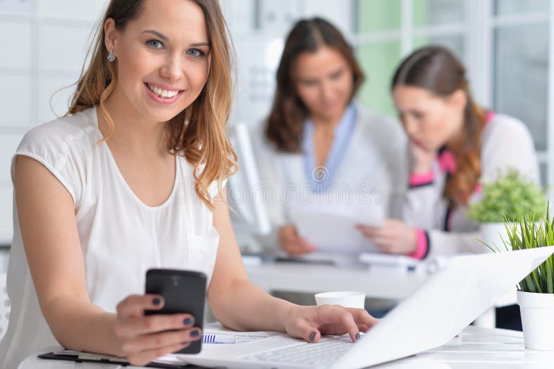 Young Women Sit at the Table and Work in a Modern Office Stock Photo ...