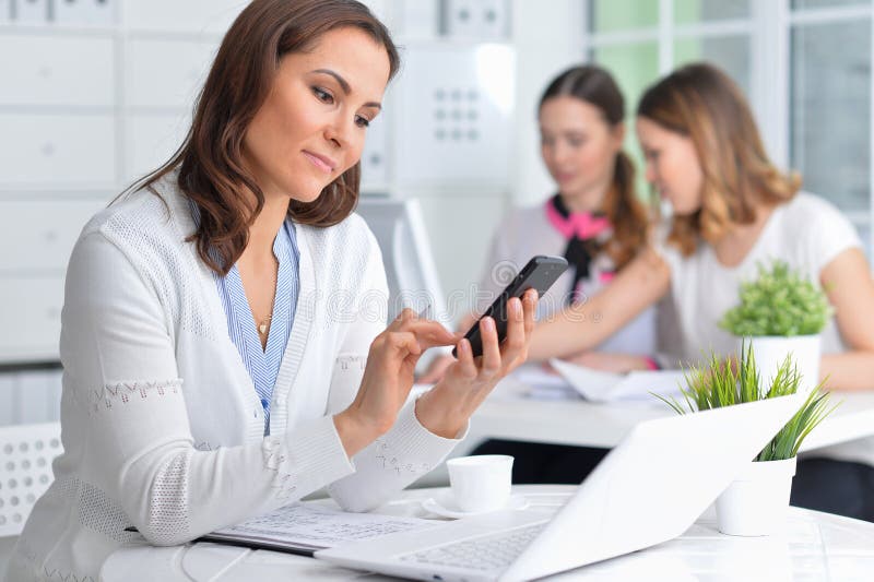 Young Women Sit at the Table and Work in a Modern Office Stock Image ...