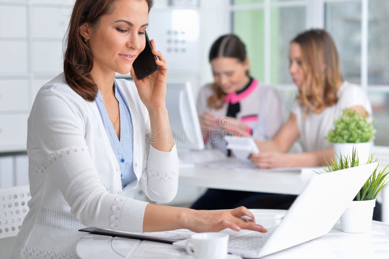 Young Women Sit at the Table and Work in a Modern Office Stock Image ...