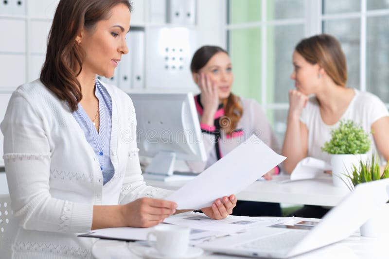 Young Women Sit at the Table and Work in a Modern Office Stock Image ...