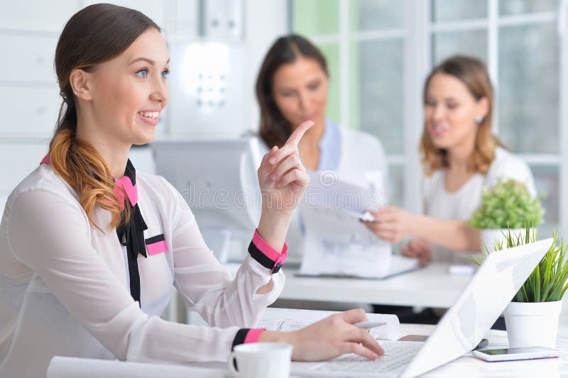 Young Women Sit at the Table and Work in a Modern Office Stock Image ...