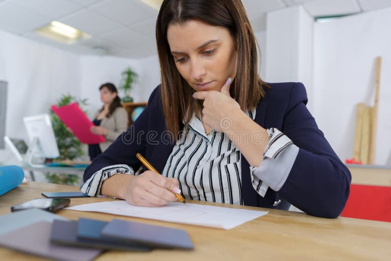 Young Woman Solving Problems on Paper Stock Photo - Image of write ...