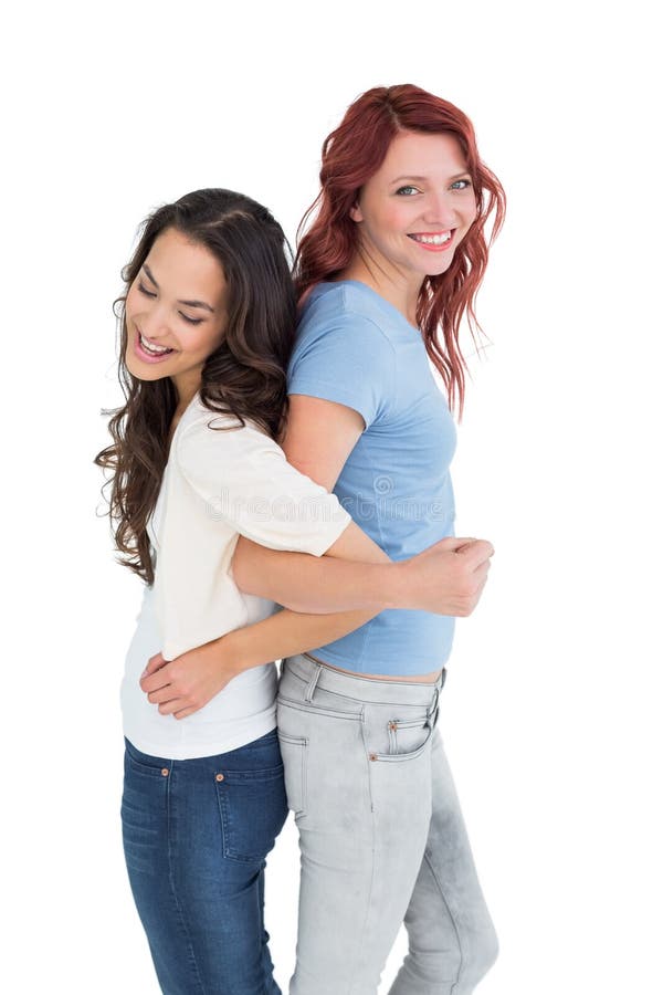 Young Women Standing Back To Back with Interlocked Hands Stock Image ...