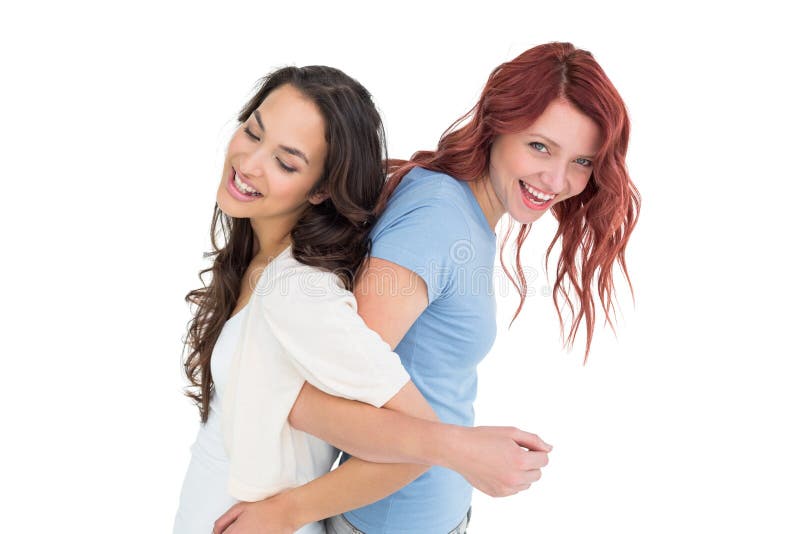Young Women Standing Back To Back with Interlocked Hands Stock Image ...