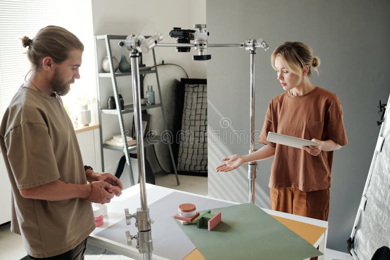 Young Woman with Tablet Pointing at Composition with Objects on Table ...