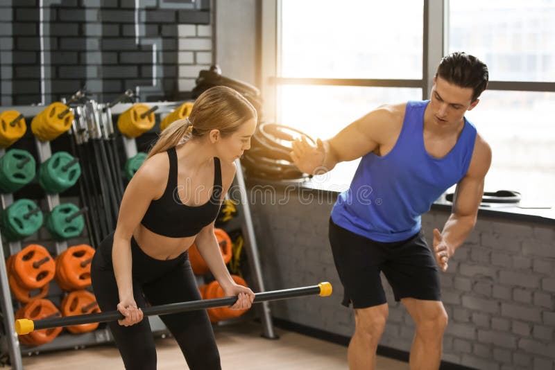 Young Woman Training with Coach in Modern Gym Stock Image - Image of ...