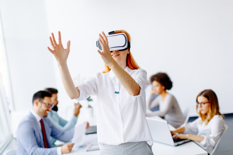Young Woman Using Virtual Reality Simulator in the Office Stock Photo ...