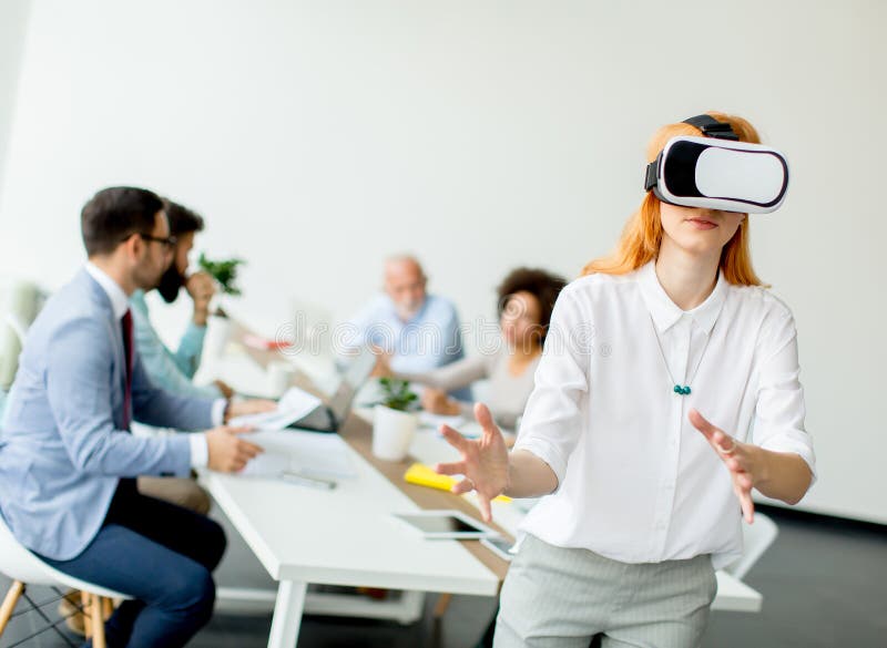 Young Woman Using Virtual Reality Simulator in the Office Stock Image ...