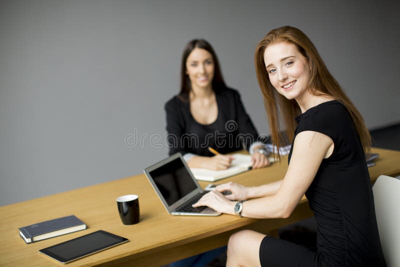 Young Women Working in the Office Stock Image - Image of pencil, office ...