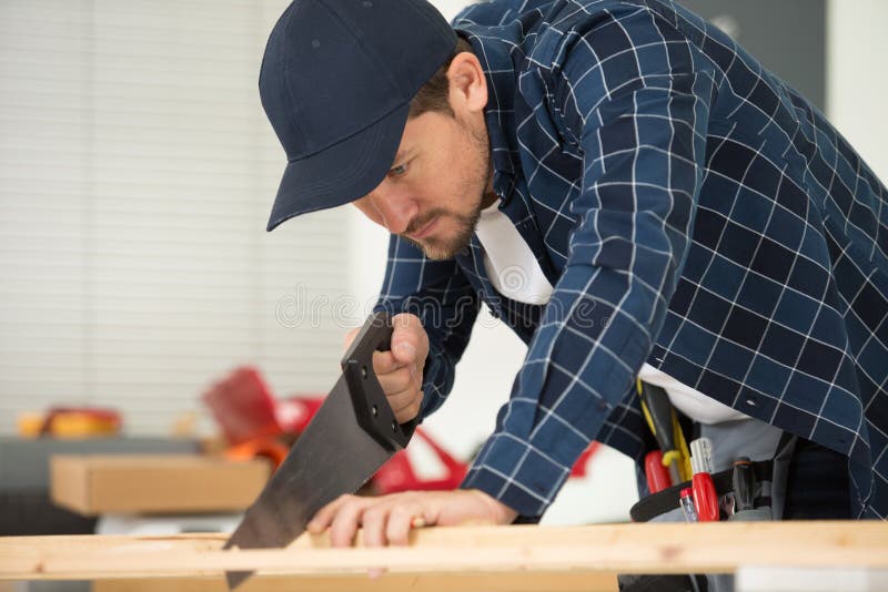 Young Woodworker Using Hand Saw Stock Image - Image of woodwork ...
