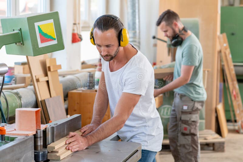 Young Worker in a Carpenter`s Workshop Using Milling Machine Stock ...