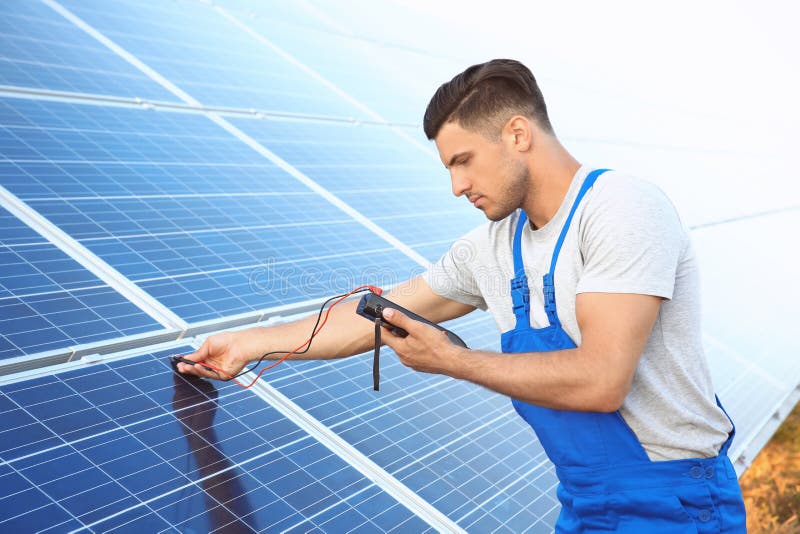 Young Worker Checking Installation of Solar Panels Stock Photo - Image ...