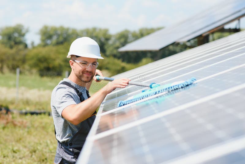 Young Worker Cleaning Solar Panels. Stock Image - Image of ...