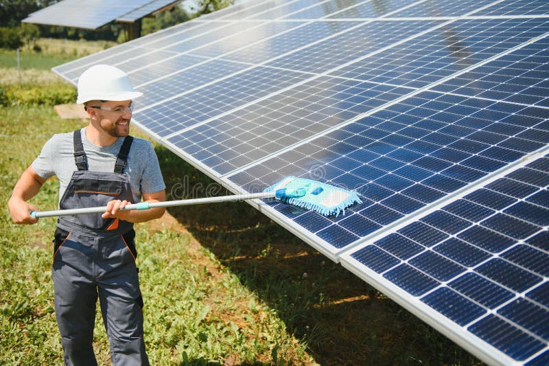 Young Worker Cleaning Solar Panels. Stock Photo - Image of green, clean ...