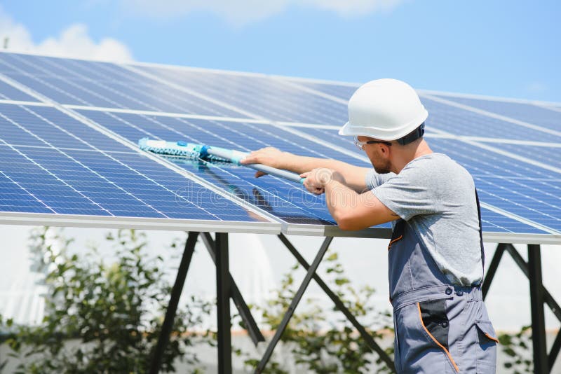 Young Worker Cleaning Solar Panels. Stock Photo - Image of business ...