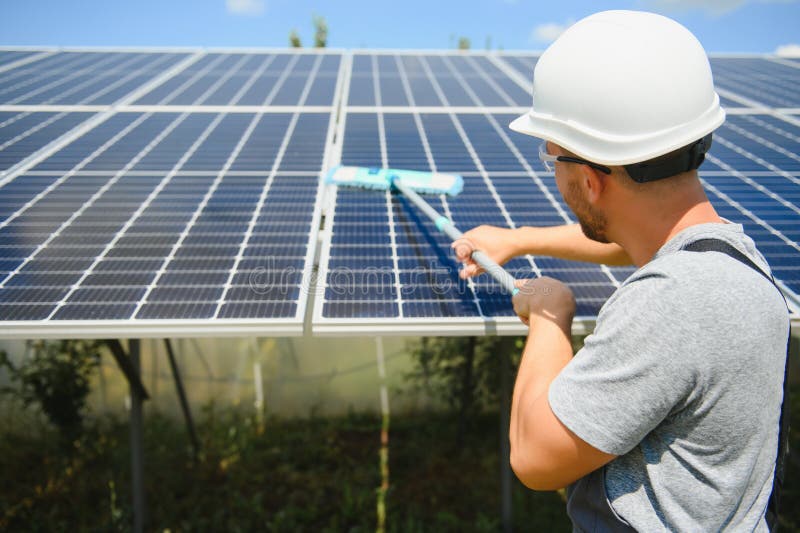 Young Worker Cleaning Solar Panels. Stock Image - Image of person ...
