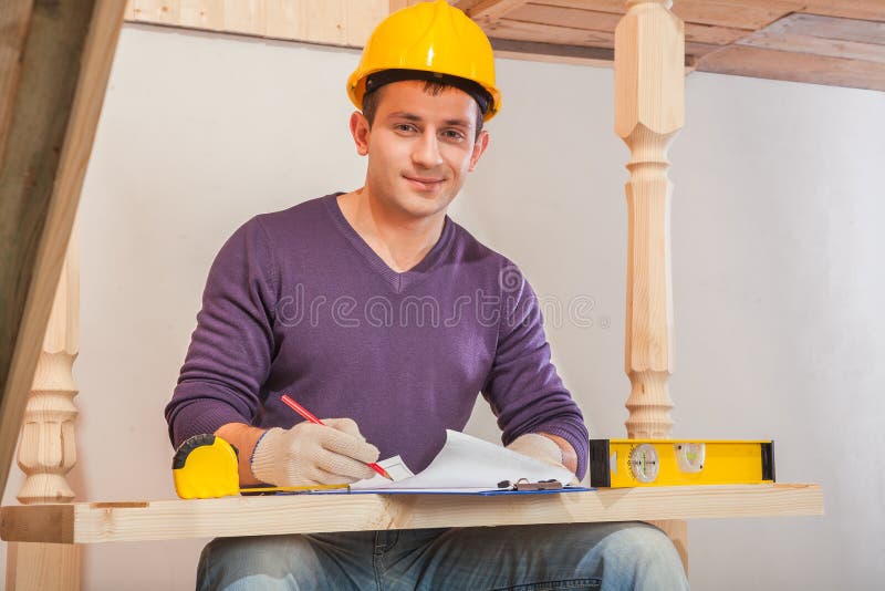Young Worker Drawing with Pencil in Blueprint Stock Photo - Image of ...