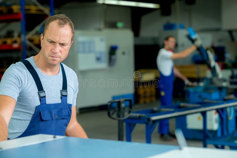 Young worker in factory stock photo. Image of manager - 51720792